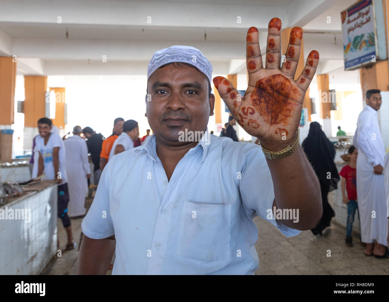 Indian man wirth a henna tattoo in his hand in the fish market, Jizan ...