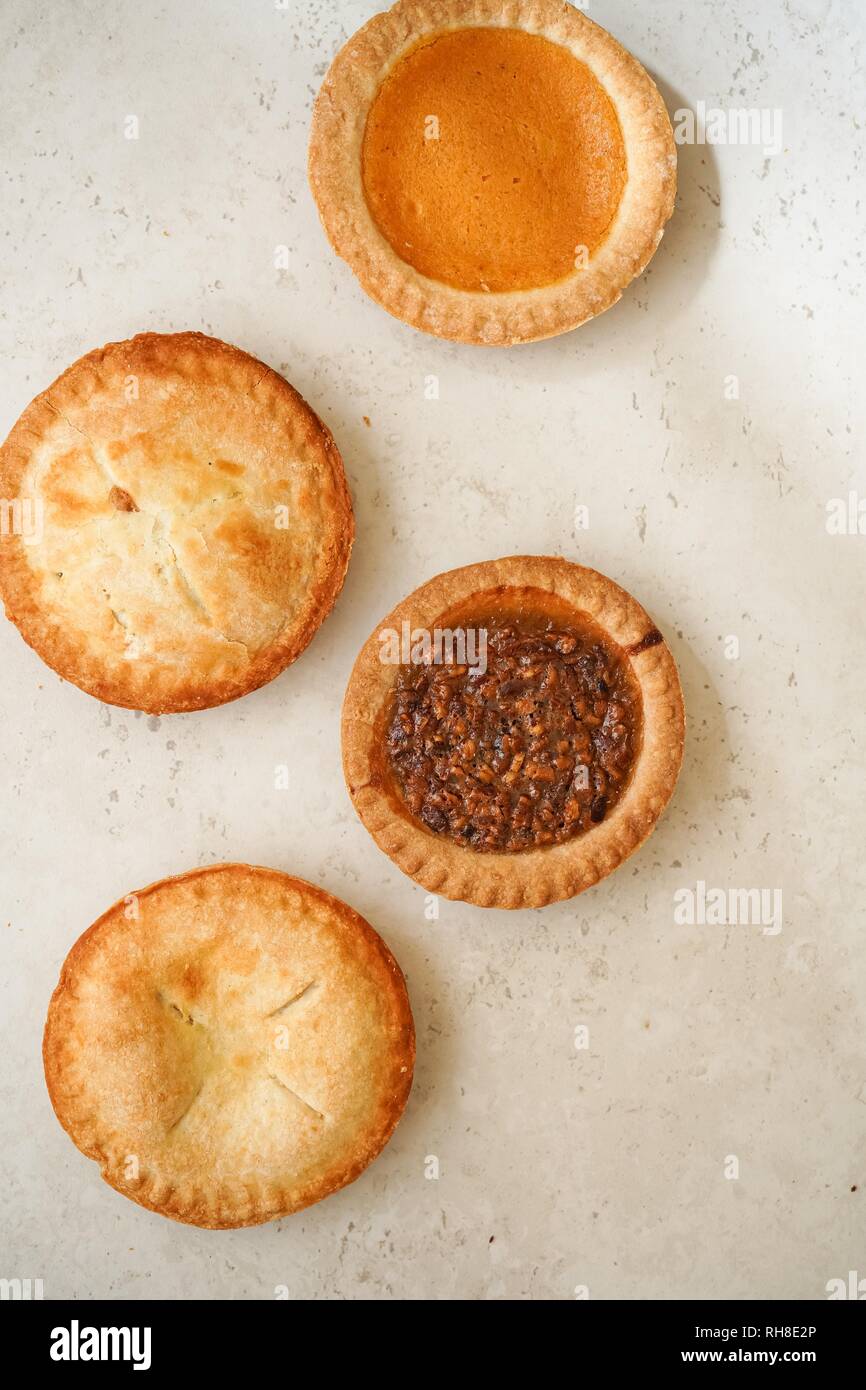 Different various types of mini pies background Stock Photo - Alamy