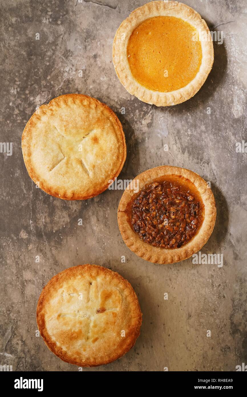 Different various types of mini pies background Stock Photo - Alamy