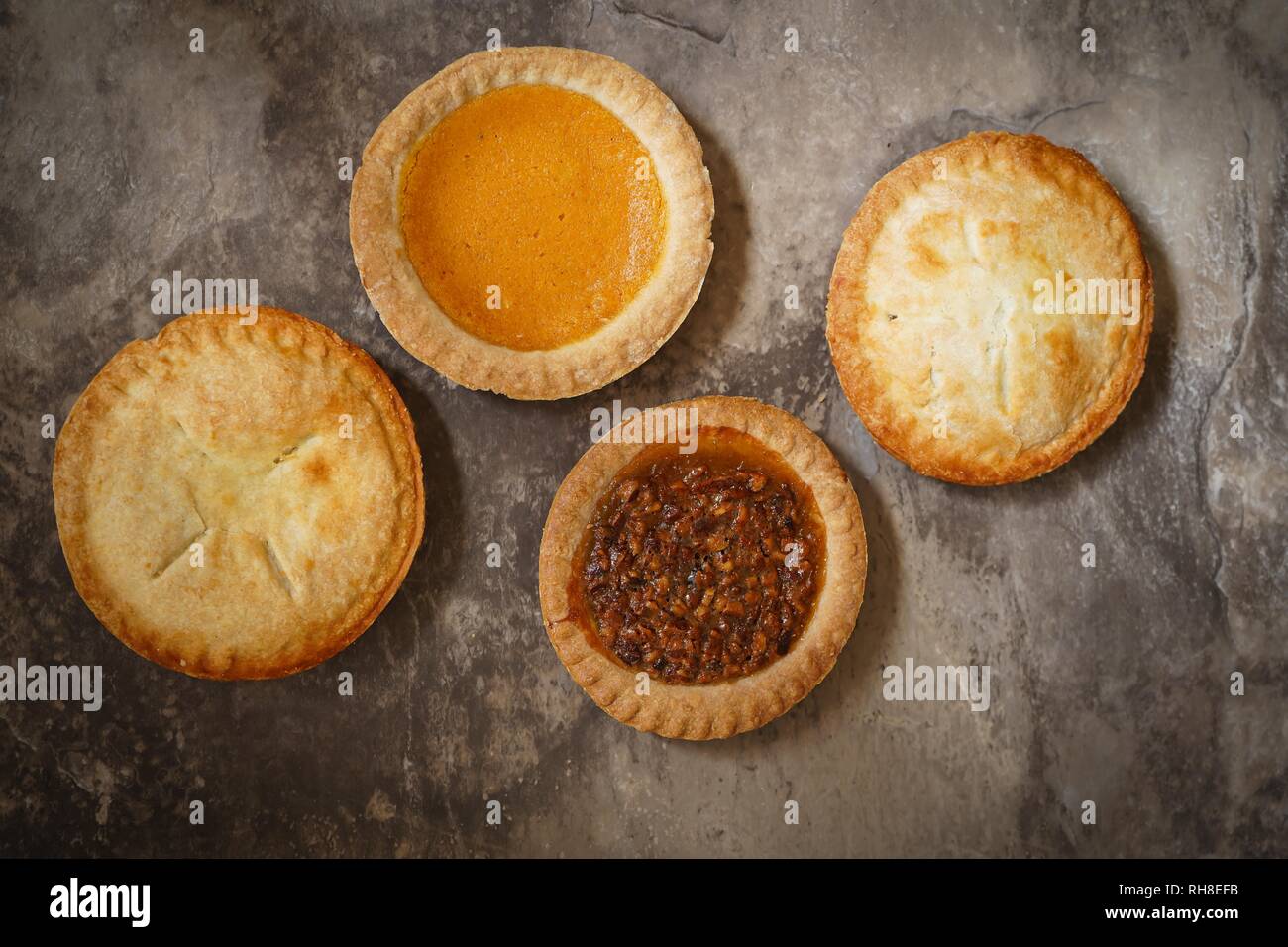 Different various types of mini pies background Stock Photo - Alamy