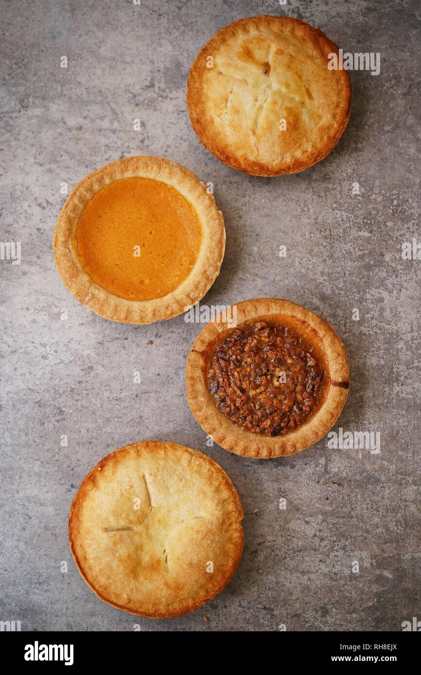 Different various types of mini pies background Stock Photo - Alamy