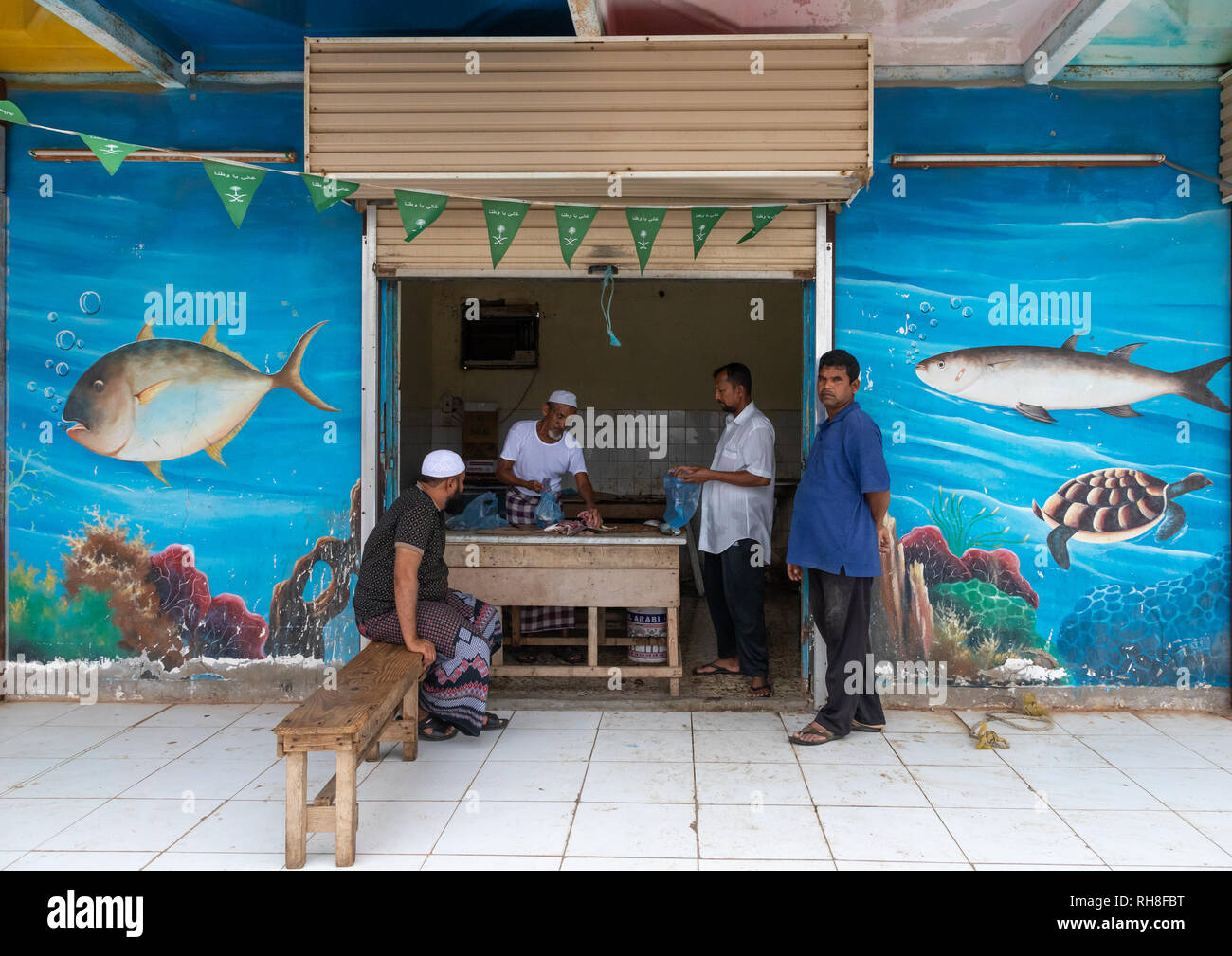 Farasani men in the fish market, Red Sea, Farasan, Saudi Arabia Stock ...