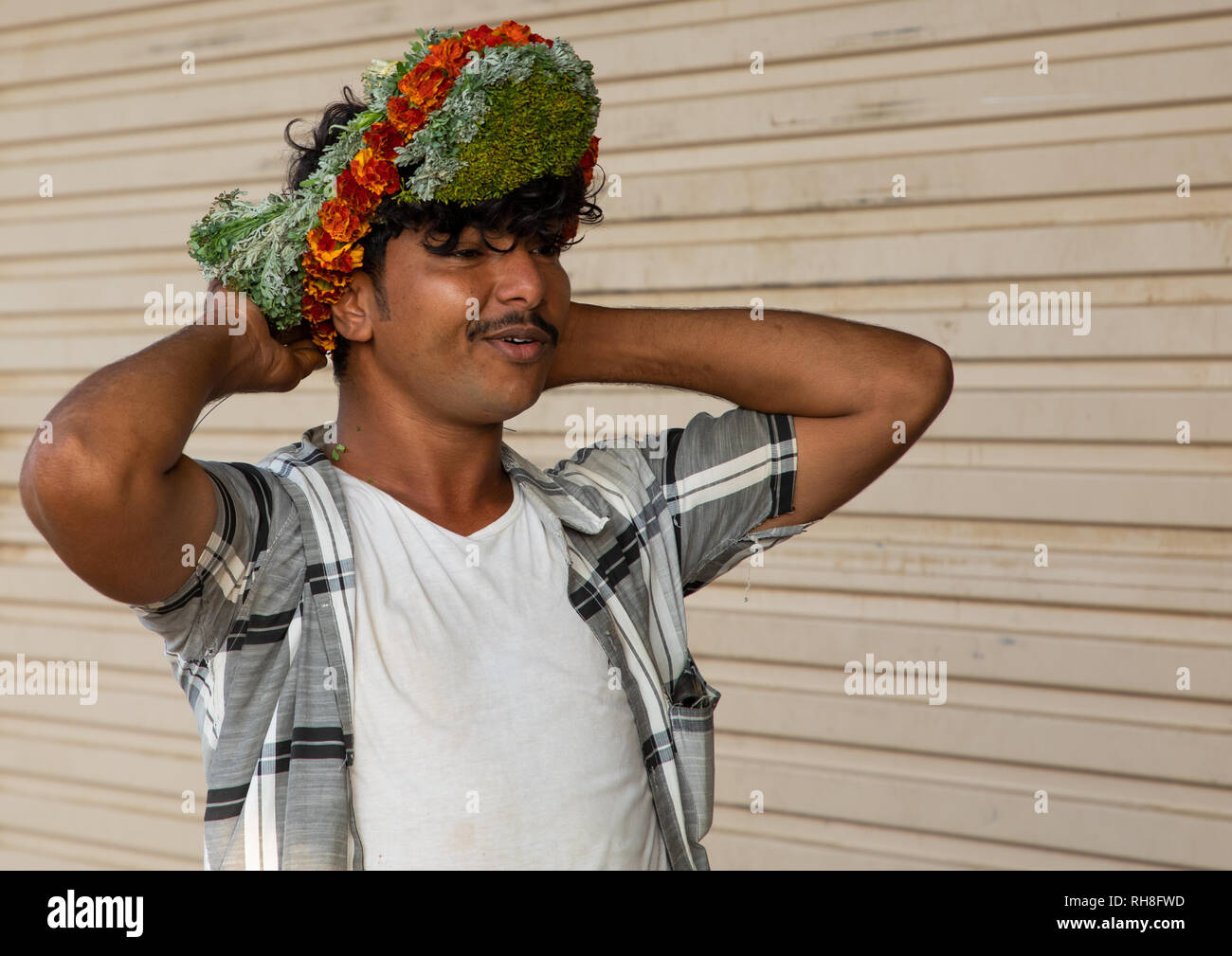Portrait of a flower man putting a floral crown on the head, Jizan ...