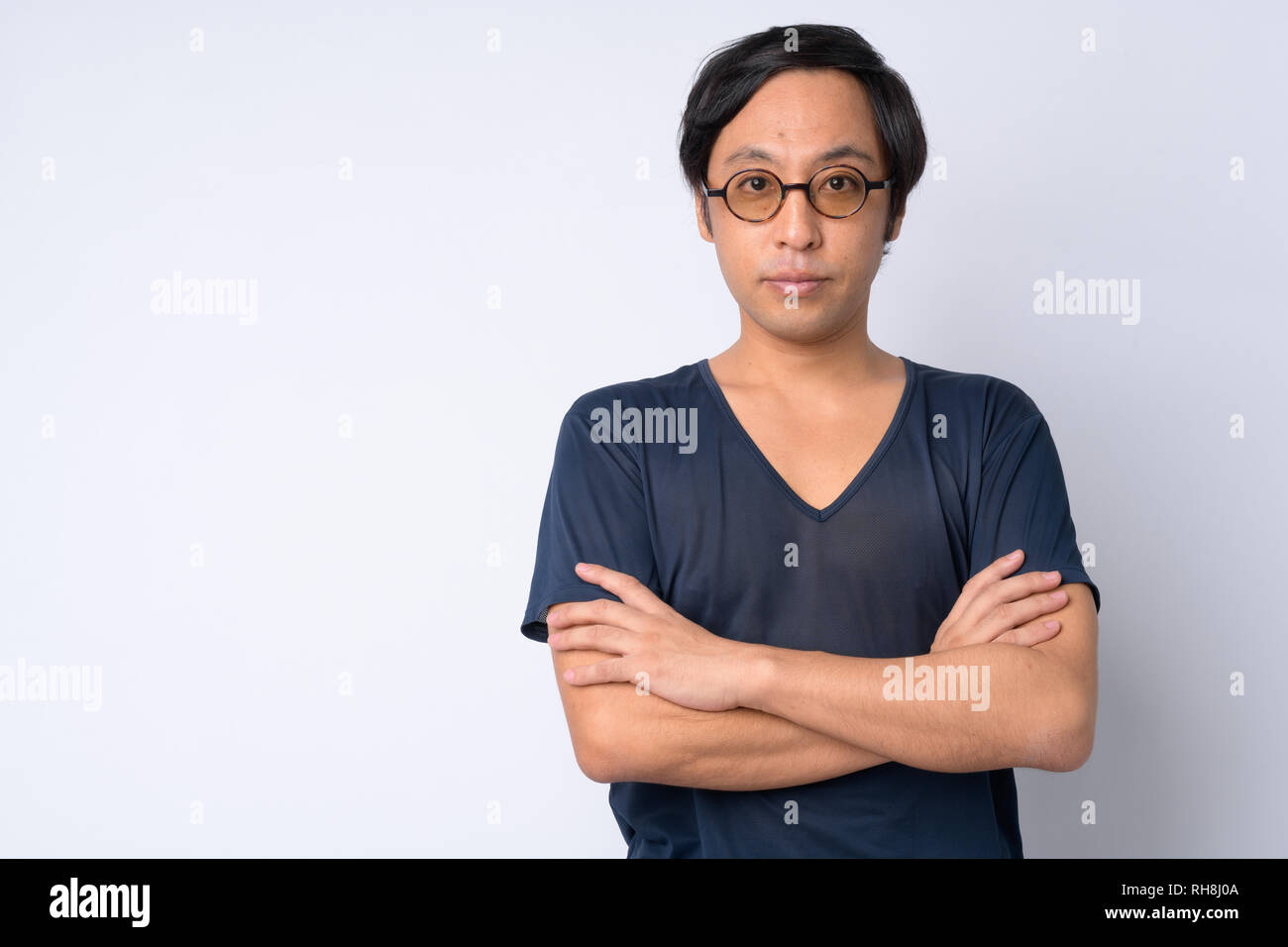 Portrait of Japanese man with arms crossed Stock Photo - Alamy