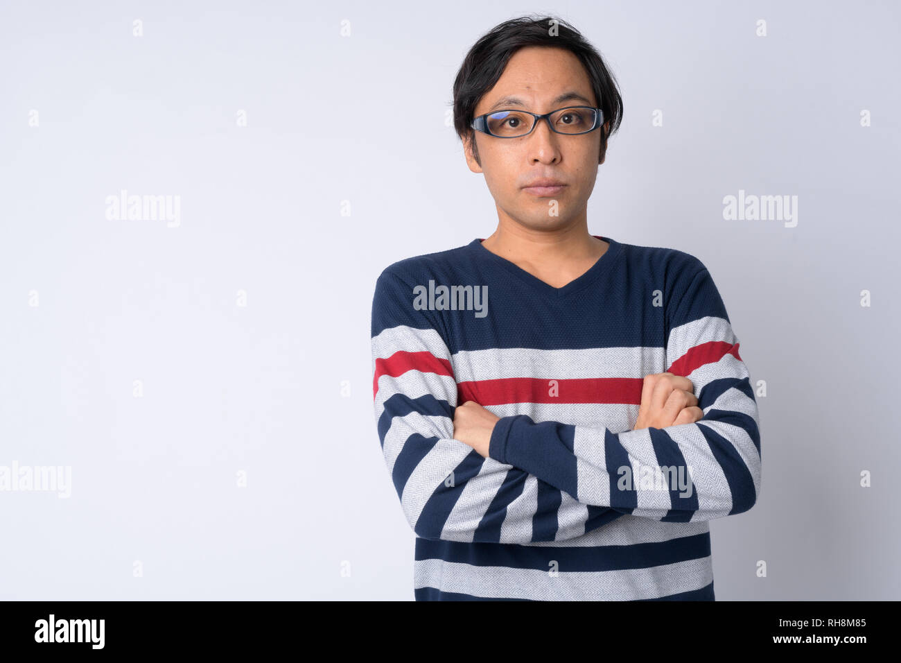 Portrait of Japanese man with arms crossed Stock Photo - Alamy