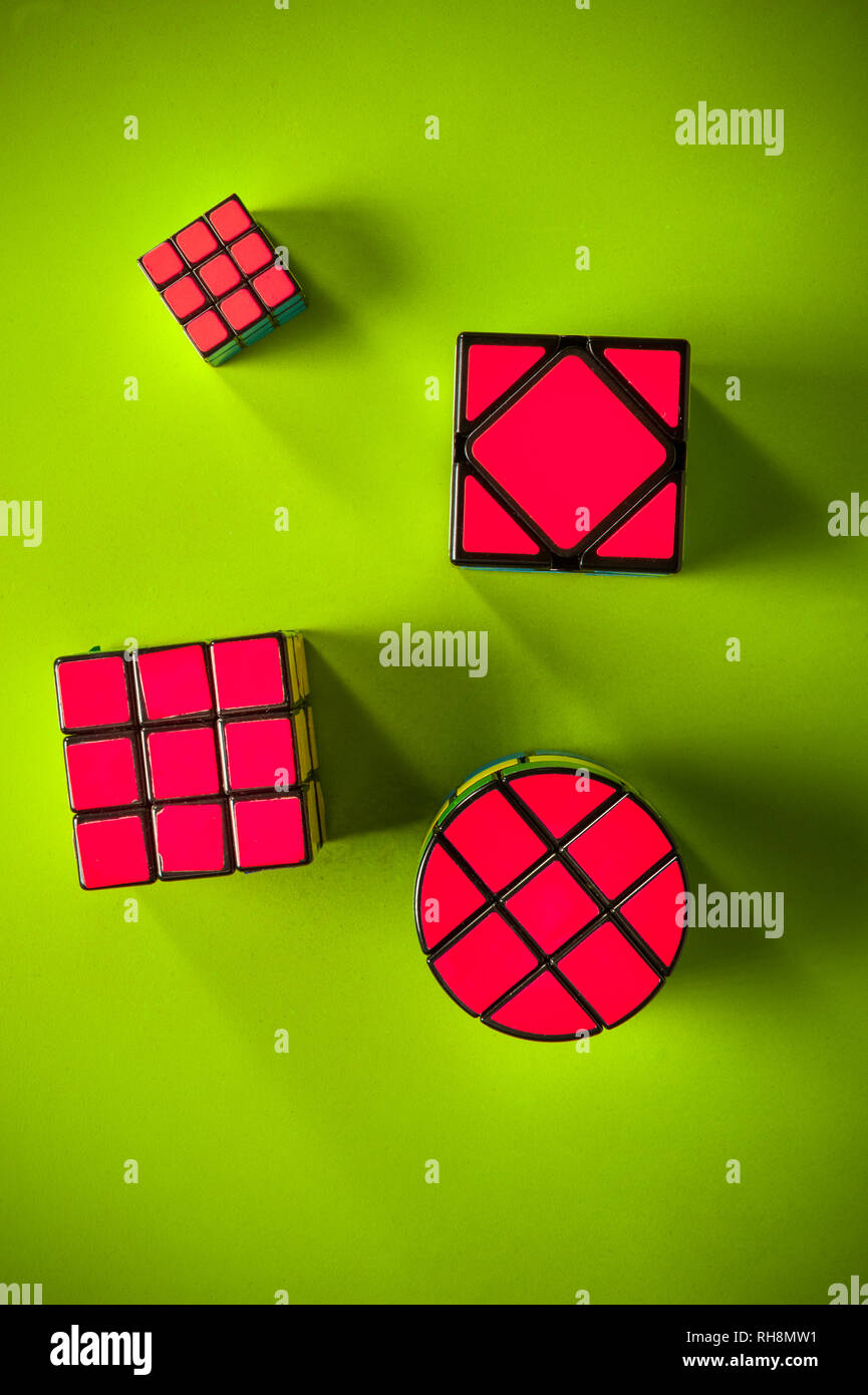 collected different conundrum on green background Stock Photo - Alamy