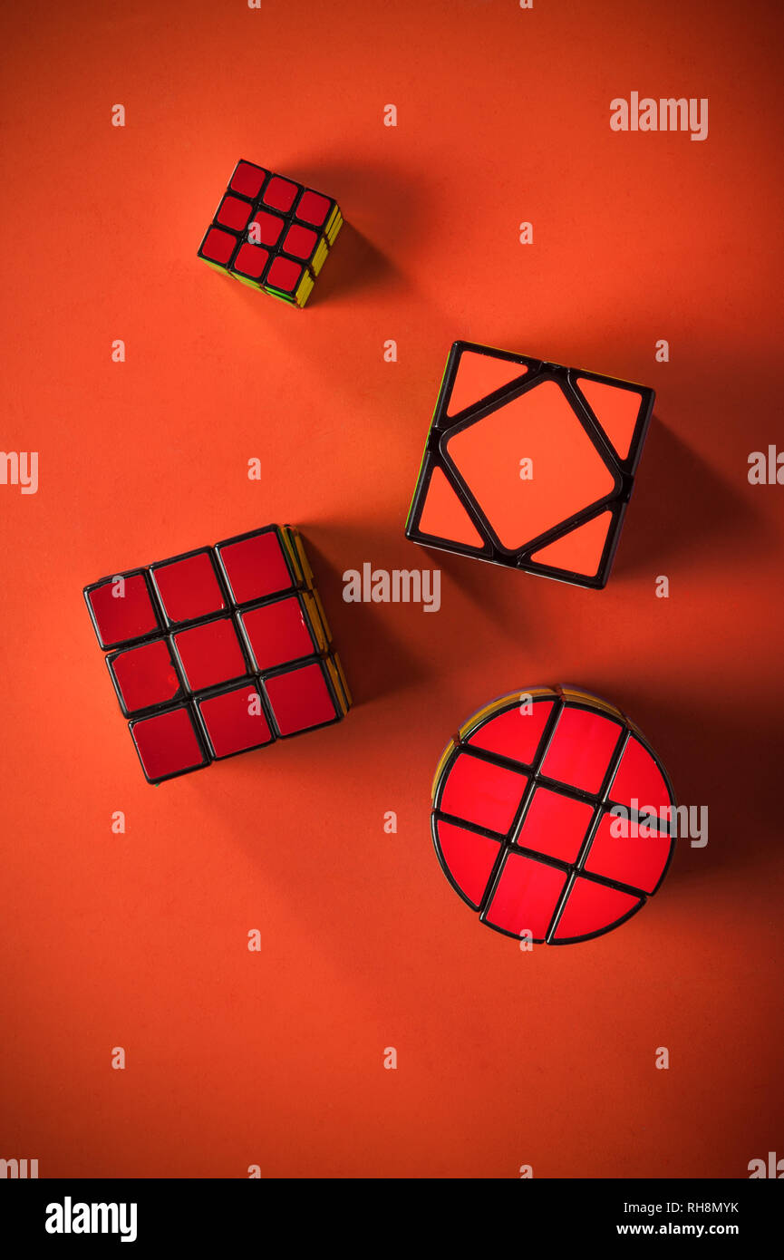 collected different conundrum on red background Stock Photo - Alamy