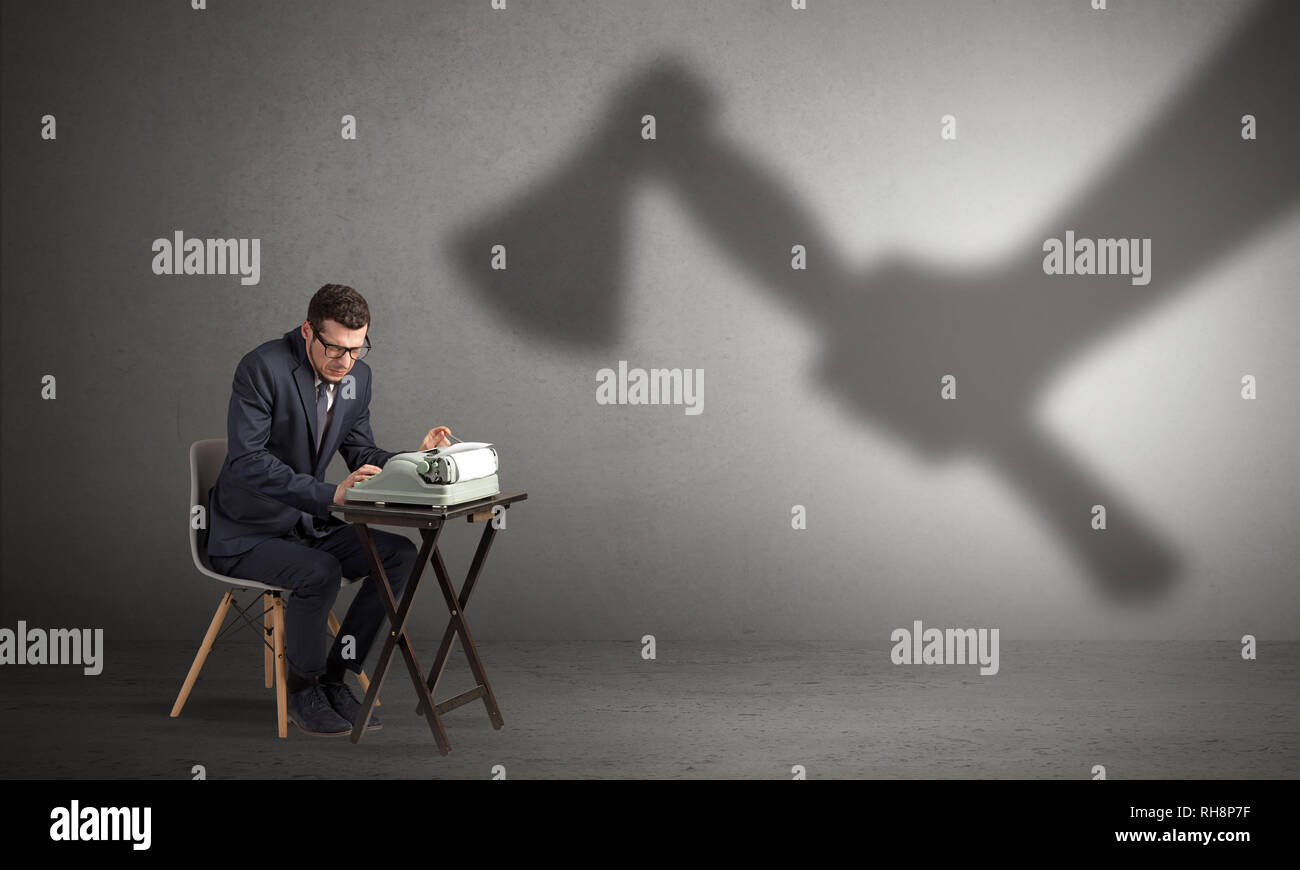 Shadow threatening hard worker man who is afraid Stock Photo - Alamy