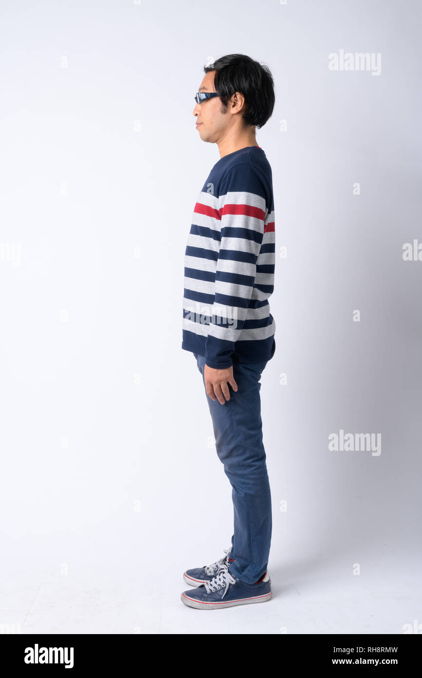 Full body shot profile view of Japanese man Stock Photo - Alamy