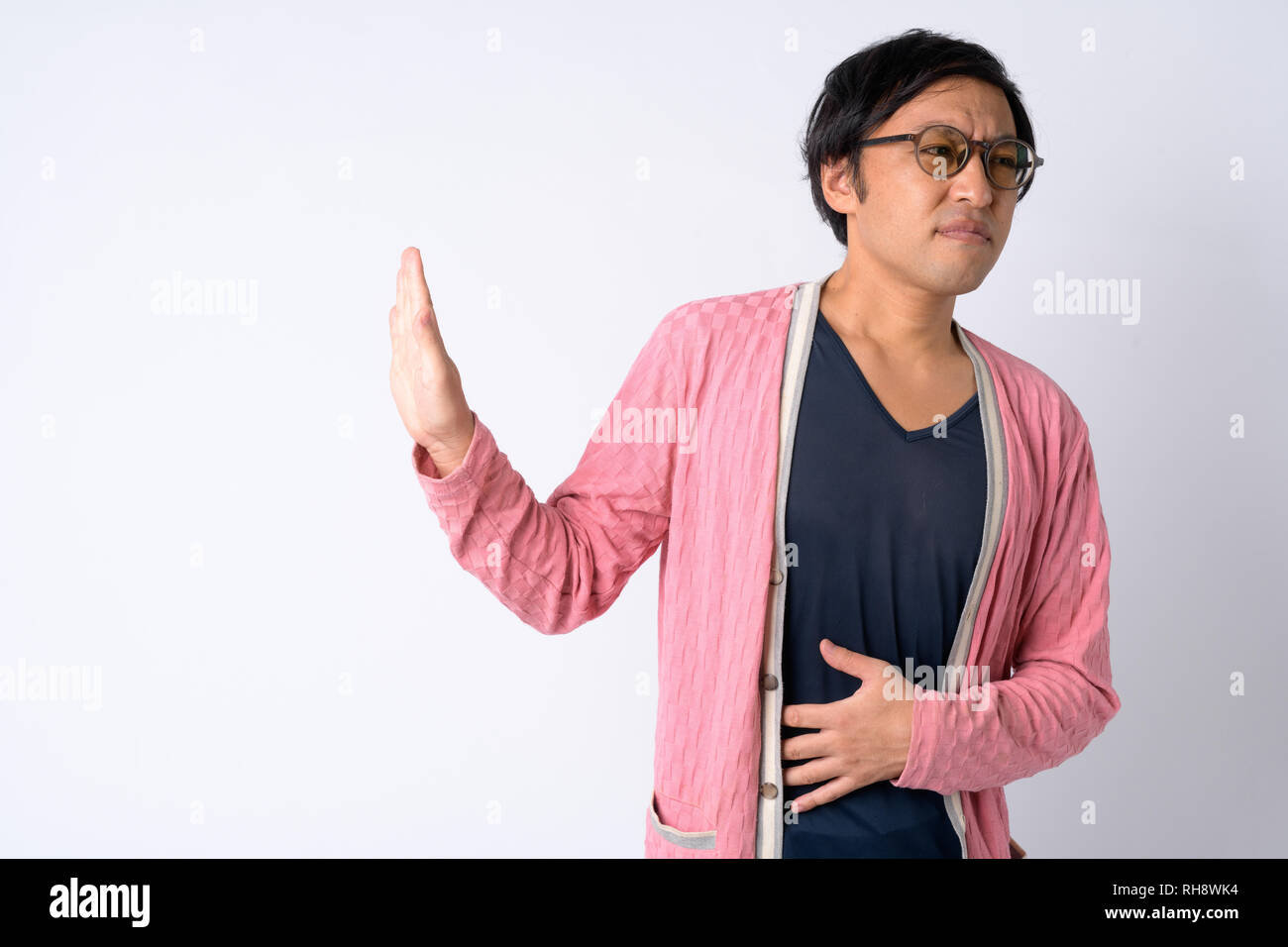 Portrait of stressed Japanese man showing stop gesture Stock Photo - Alamy