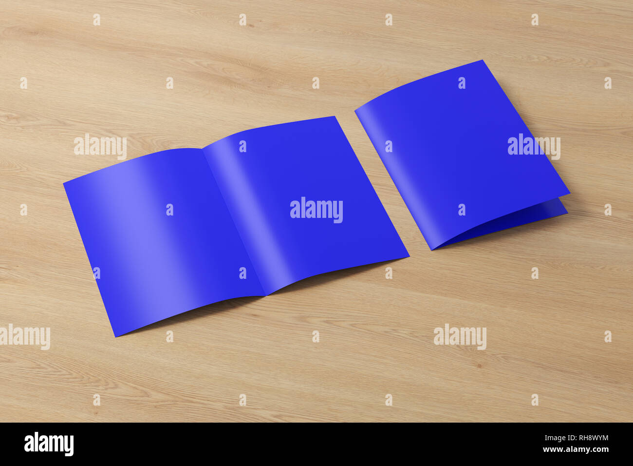 Blank blue open and folded half-folded flyer leaflet on wooden ...