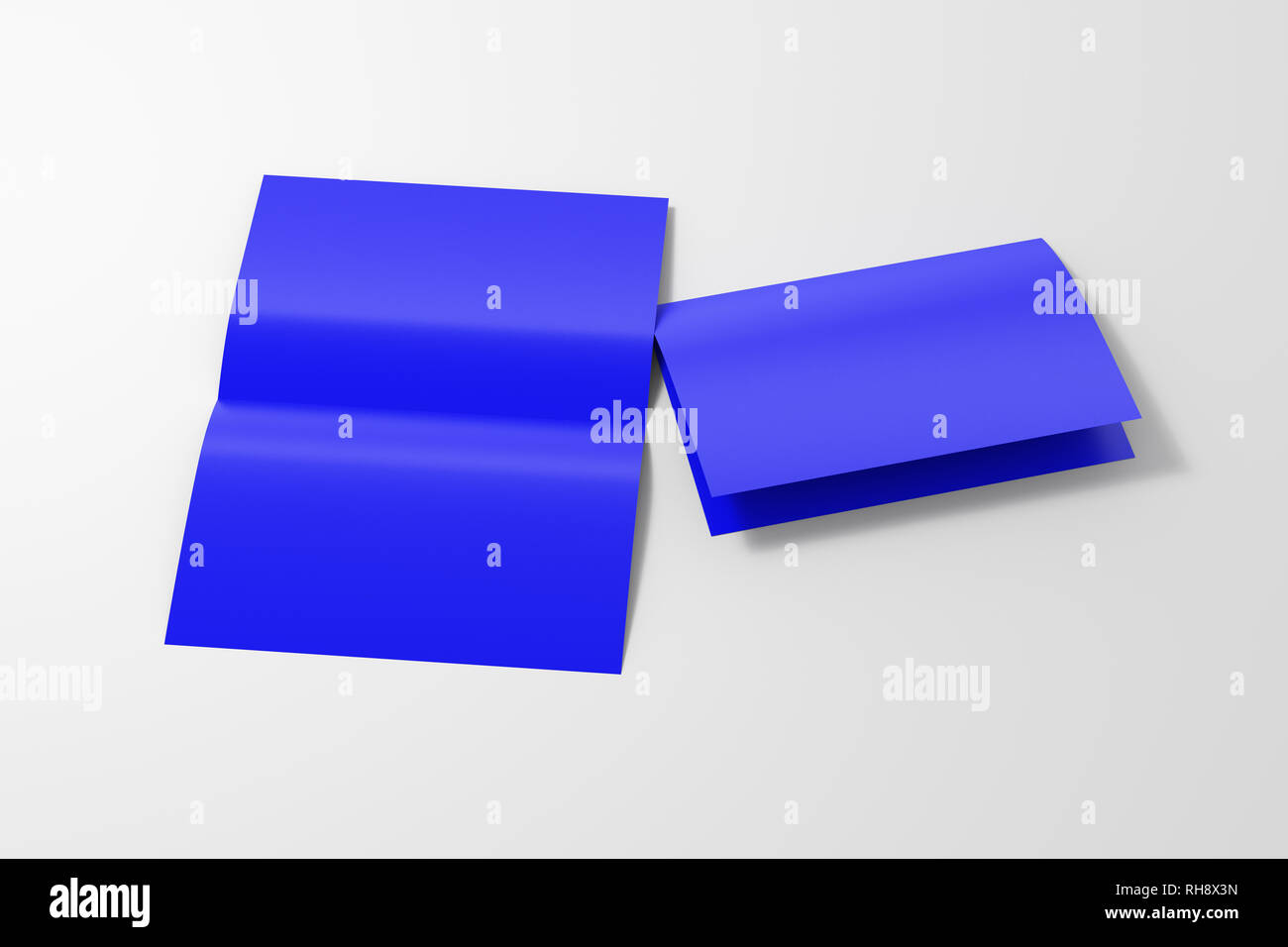 Blank blue open and folded half-folded flyer leaflet on white ...