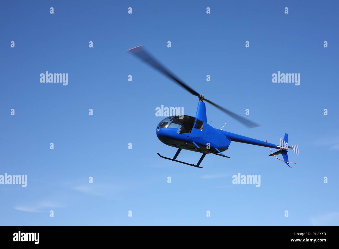 The aircraft - blue helicopter makes flight at low height Stock Photo ...