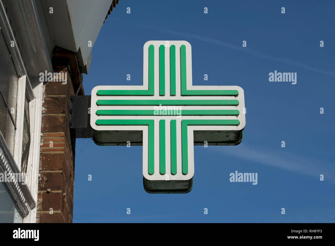 british green and white cross indicating a pharmacy Stock Photo - Alamy