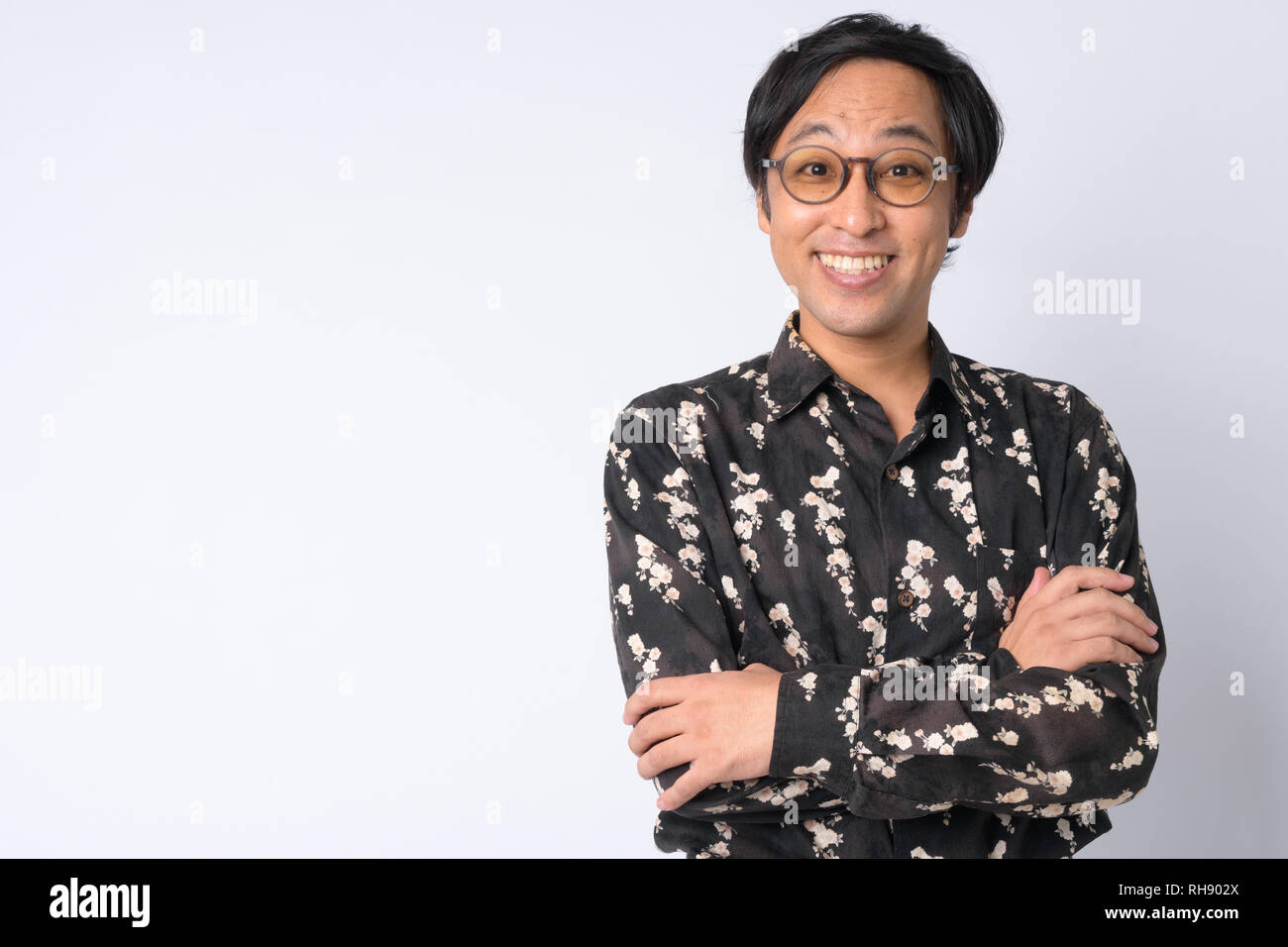 Portrait of happy Japanese businessman with arms crossed Stock Photo ...