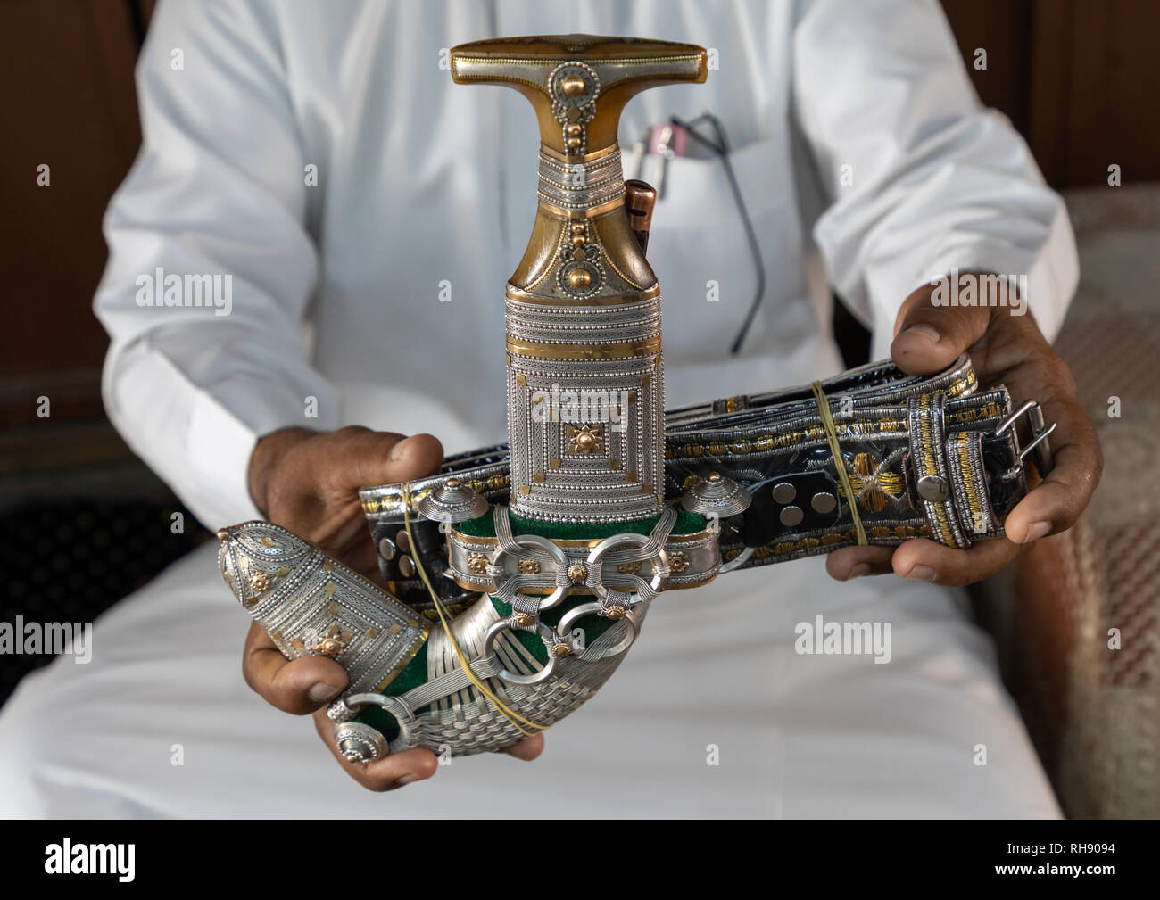Saudi man holding a janbiya dagger, Najran Province, Najran, Saudi ...
