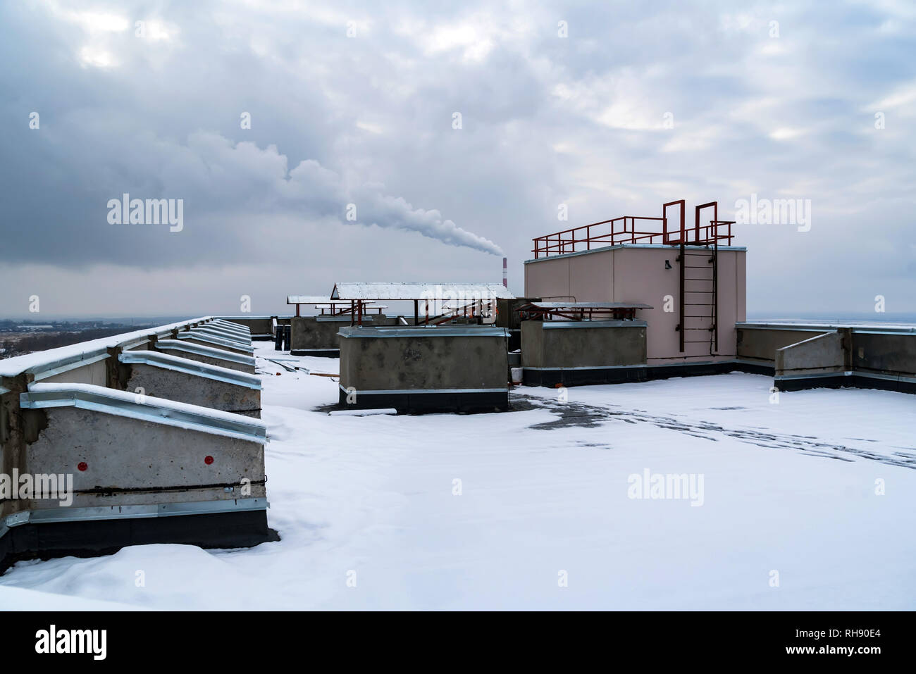 The empty rooftop of highrise building covered with snow Stock Photo ...