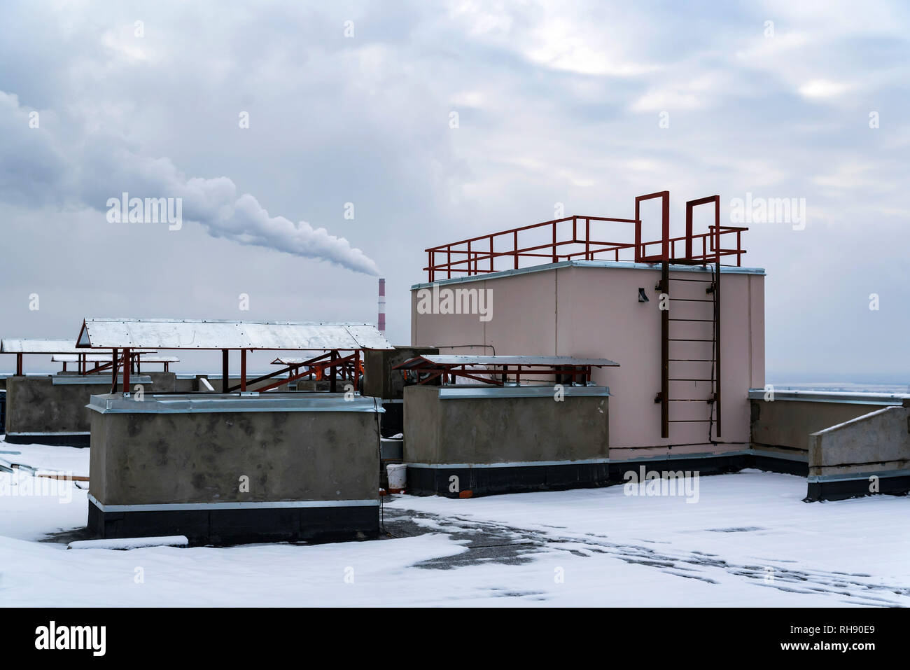 The empty rooftop of highrise building covered with snow Stock Photo ...