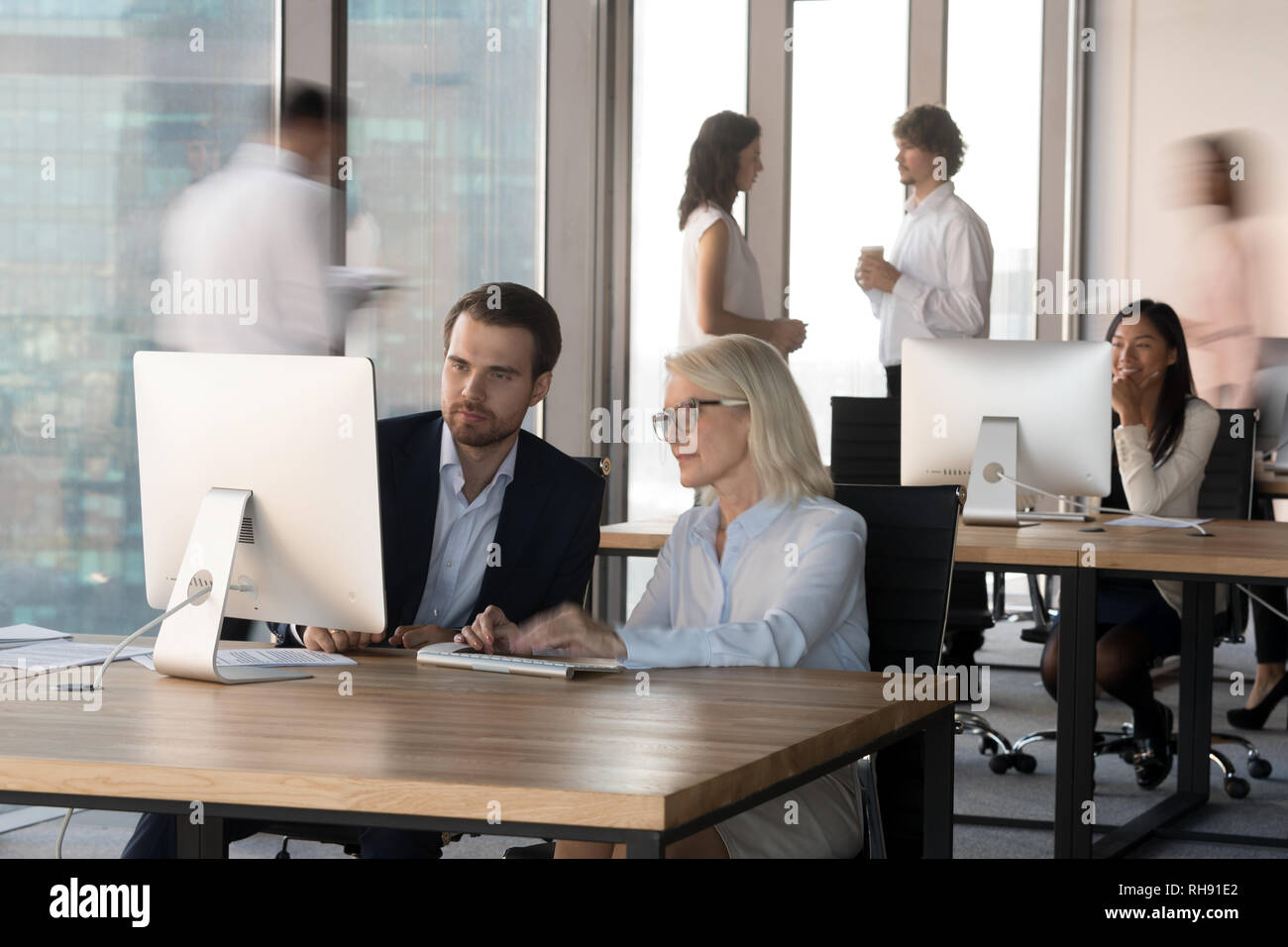 Company employees working in software hi-res stock photography and ...