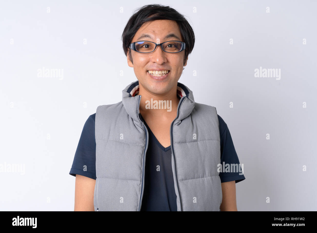 Portrait of happy Japanese man smiling ready for hiking Stock Photo - Alamy