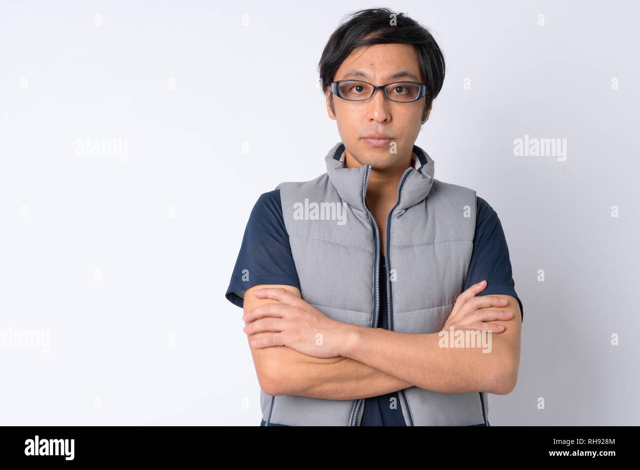 Portrait of Japanese man with arms crossed ready for hiking Stock Photo ...