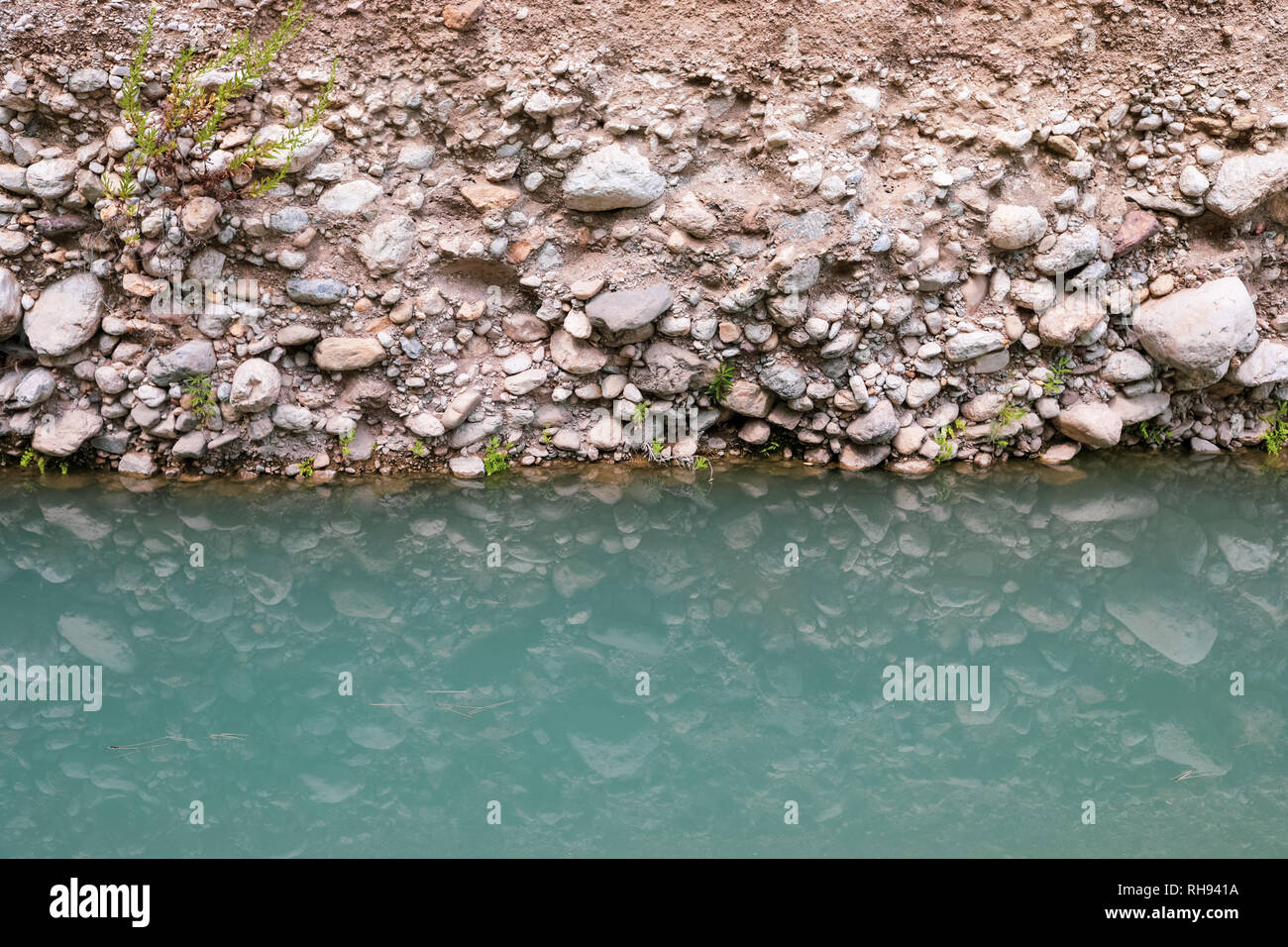 Calm water surface rocky shore hi-res stock photography and images - Alamy