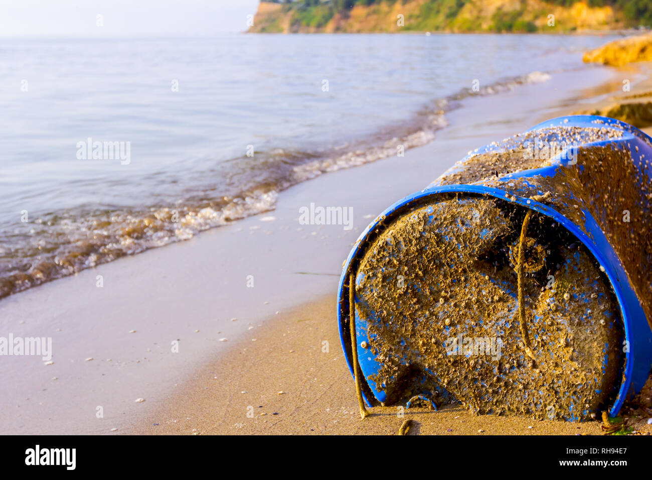 Used blue plastic drums for storing water and other liquids is washed ...