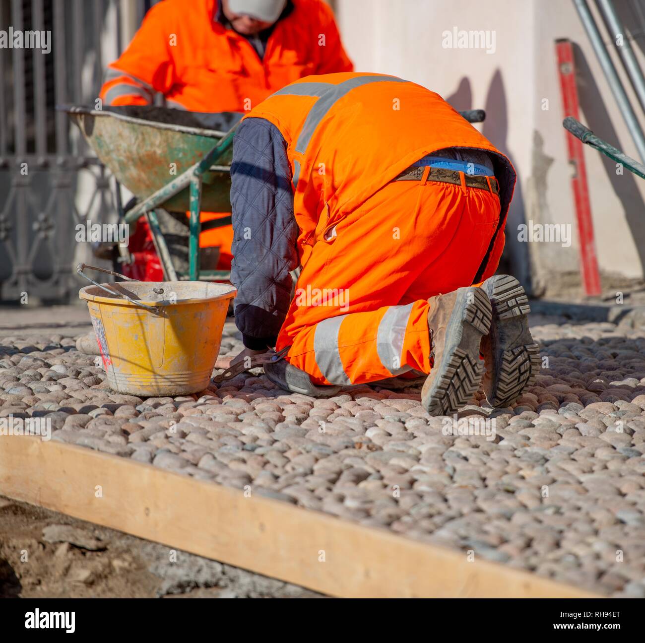 worker laying in pebble floor Stock Photo - Alamy