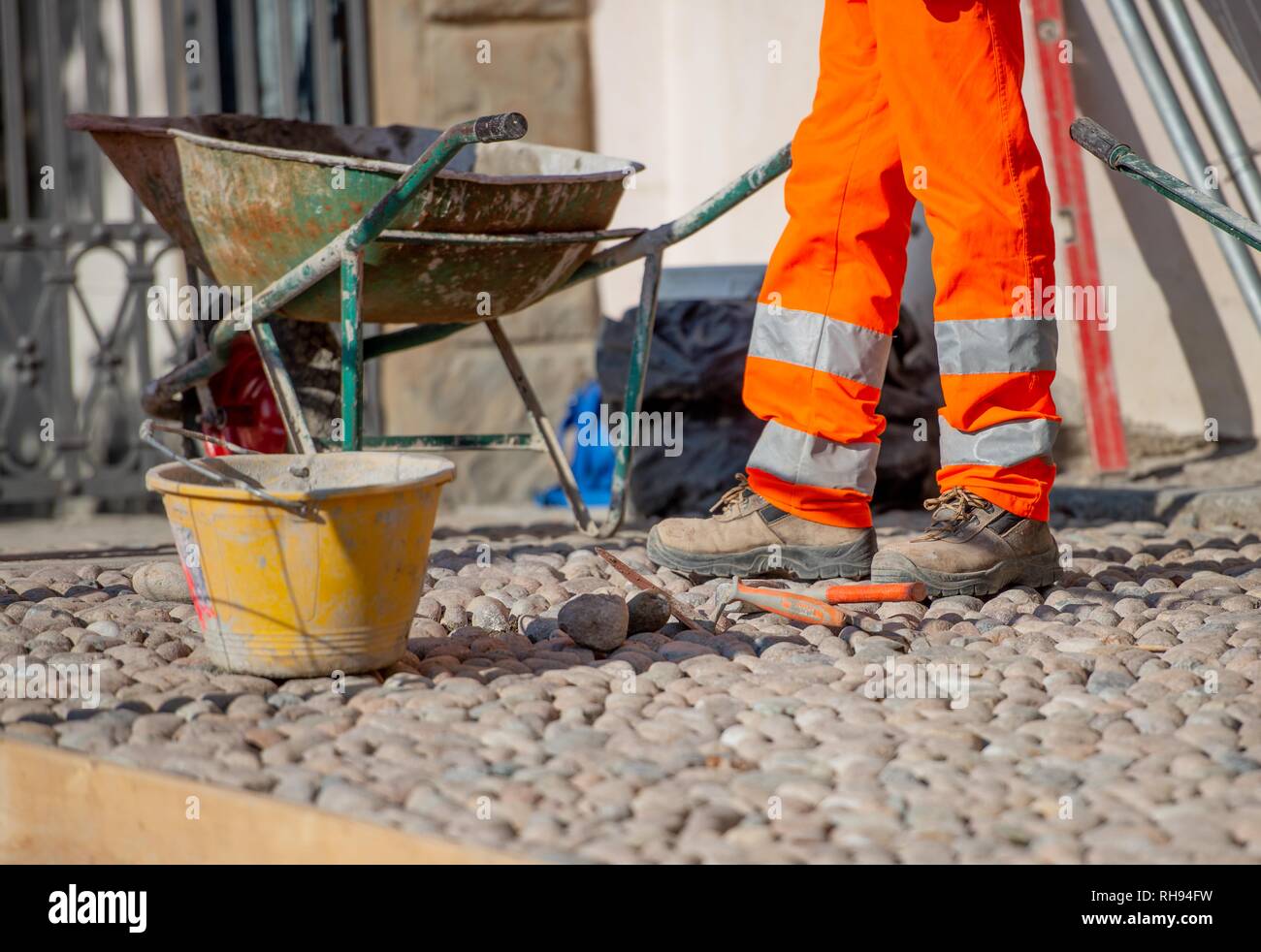 worker laying in pebble floor Stock Photo - Alamy