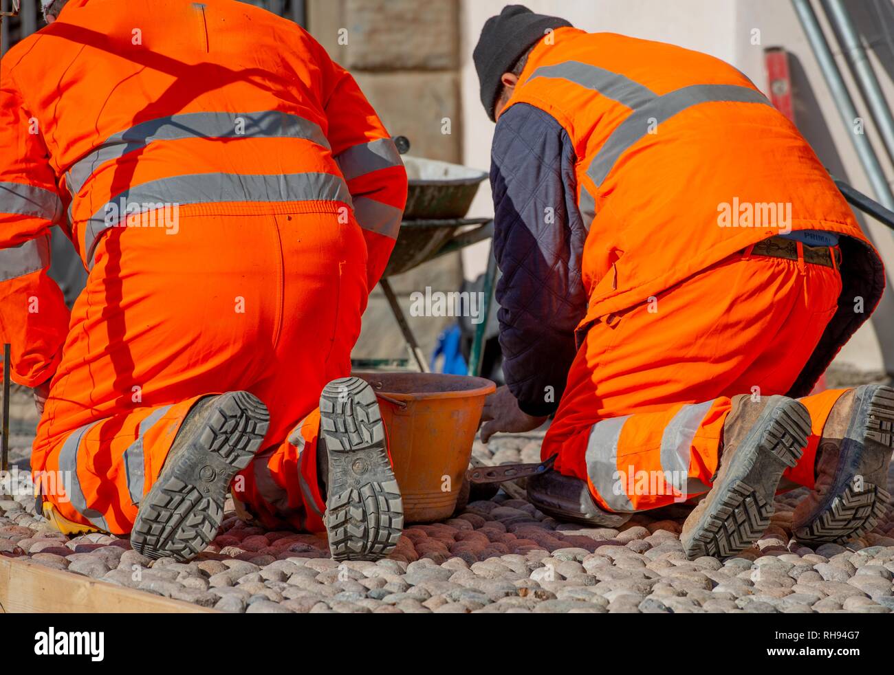 worker laying in pebble floor Stock Photo - Alamy