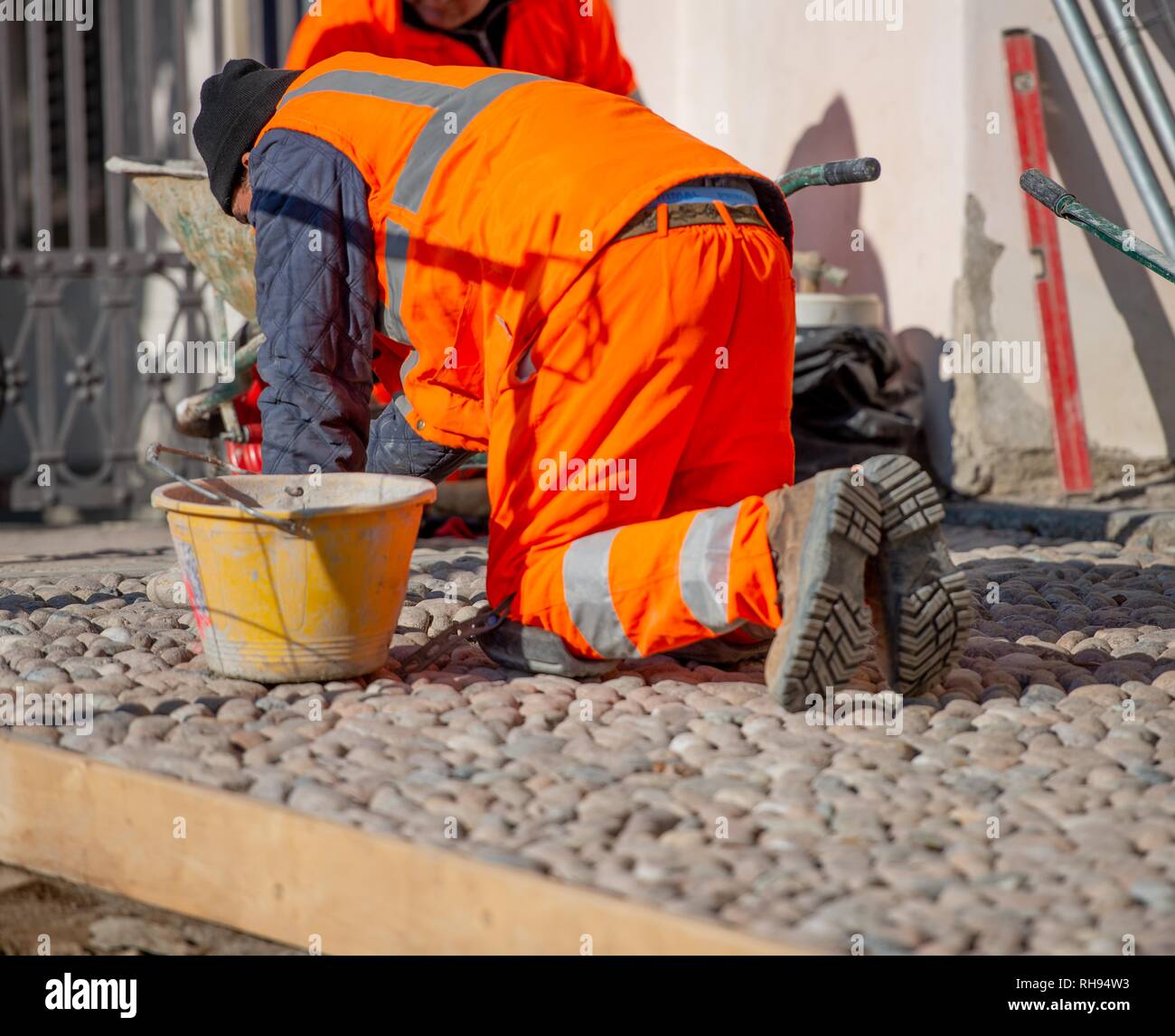 worker laying in pebble floor Stock Photo - Alamy