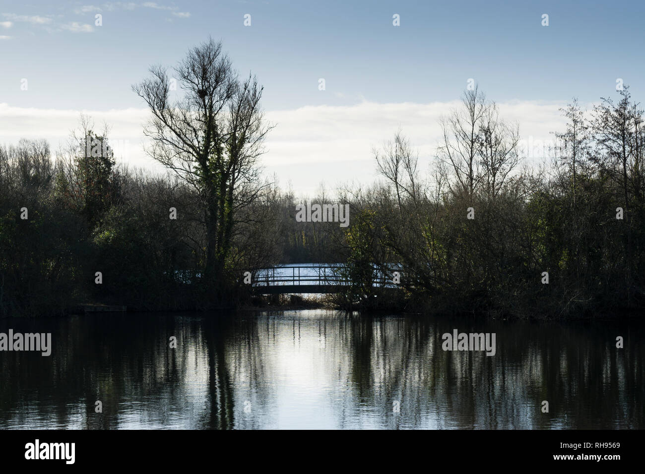 Bridge over calm water Stock Photo - Alamy