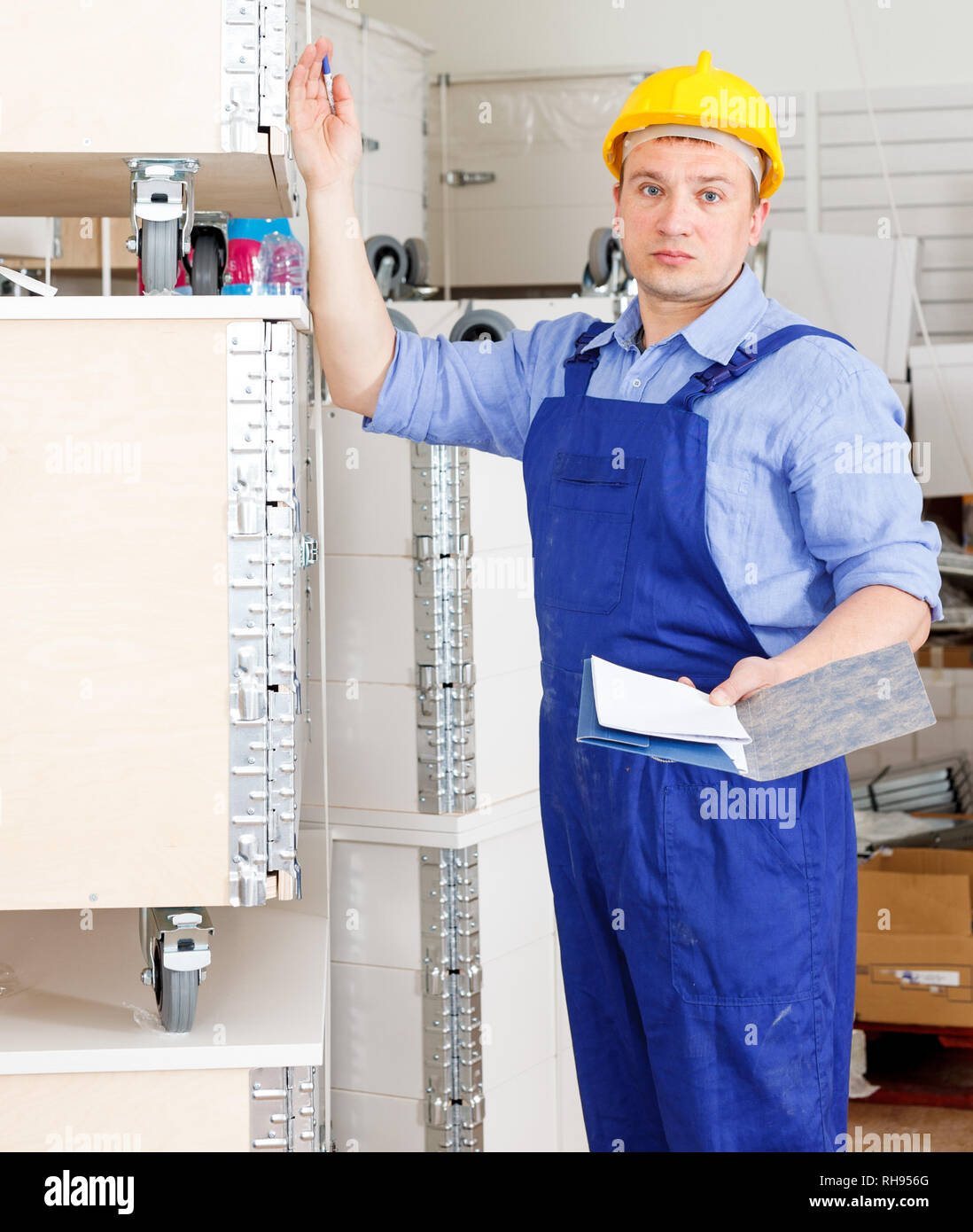 Professional builder getting ready for repair works indoors, making ...