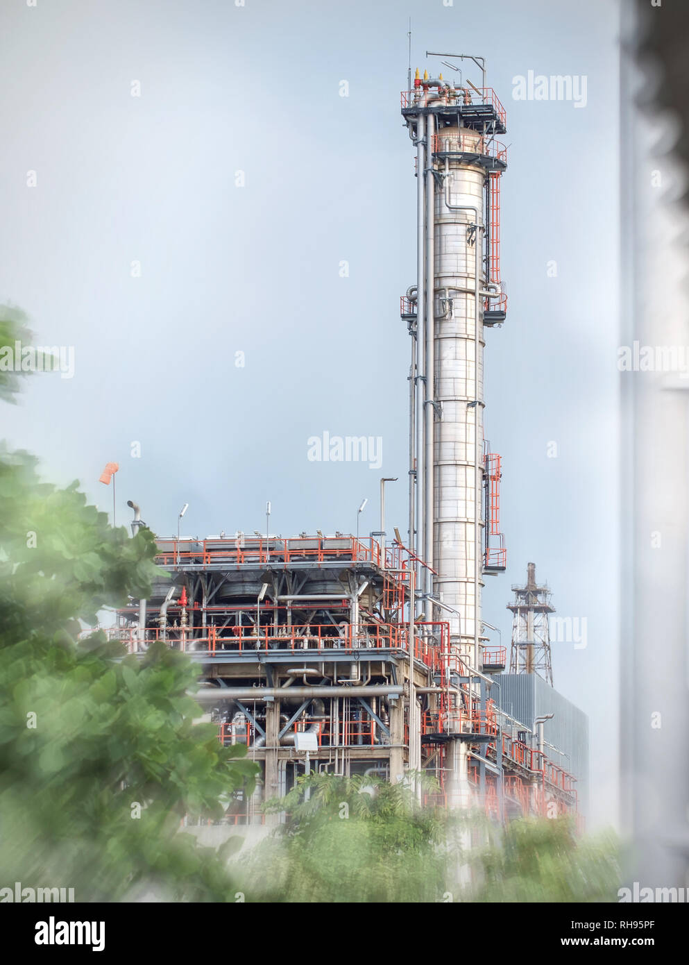 View of oil refinery on blue sky background Stock Photo - Alamy