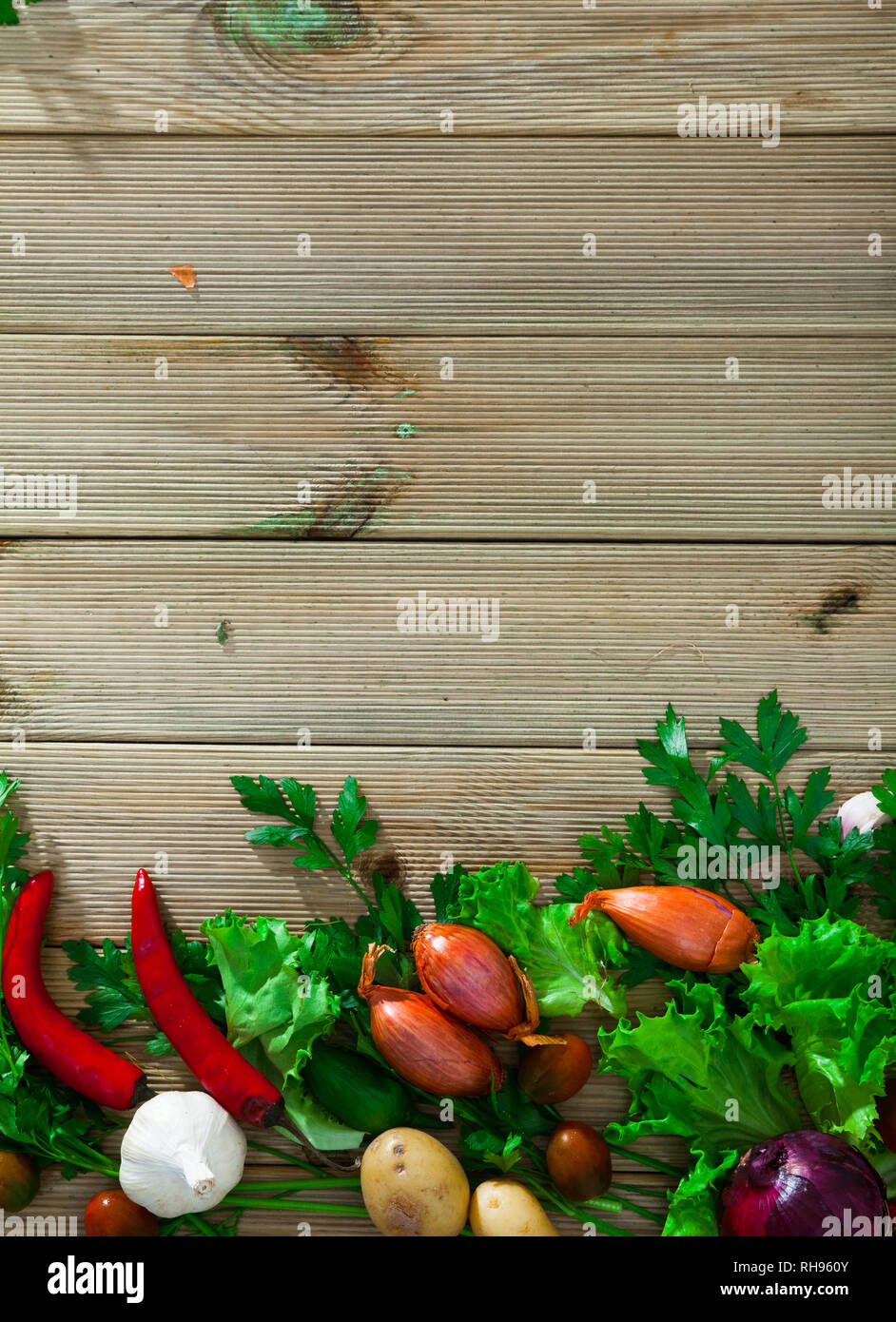 Natural wooden background with fresh vegetables assortment, top view ...