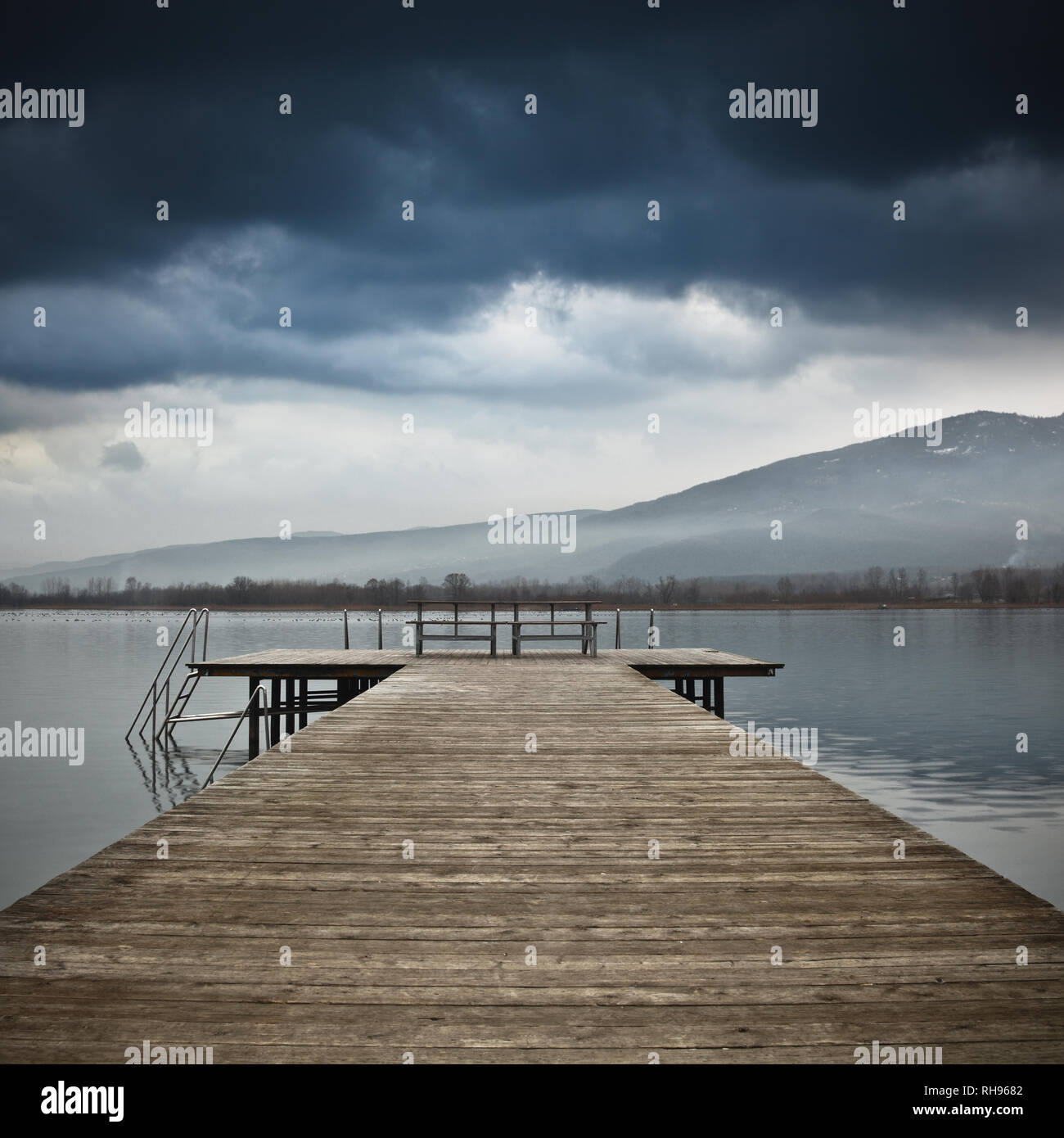 Photo of old wooden jetty on lake Stock Photo - Alamy