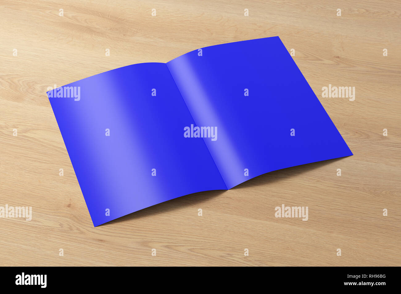 Blank blue half-folded flyer leaflet on wooden background. With ...