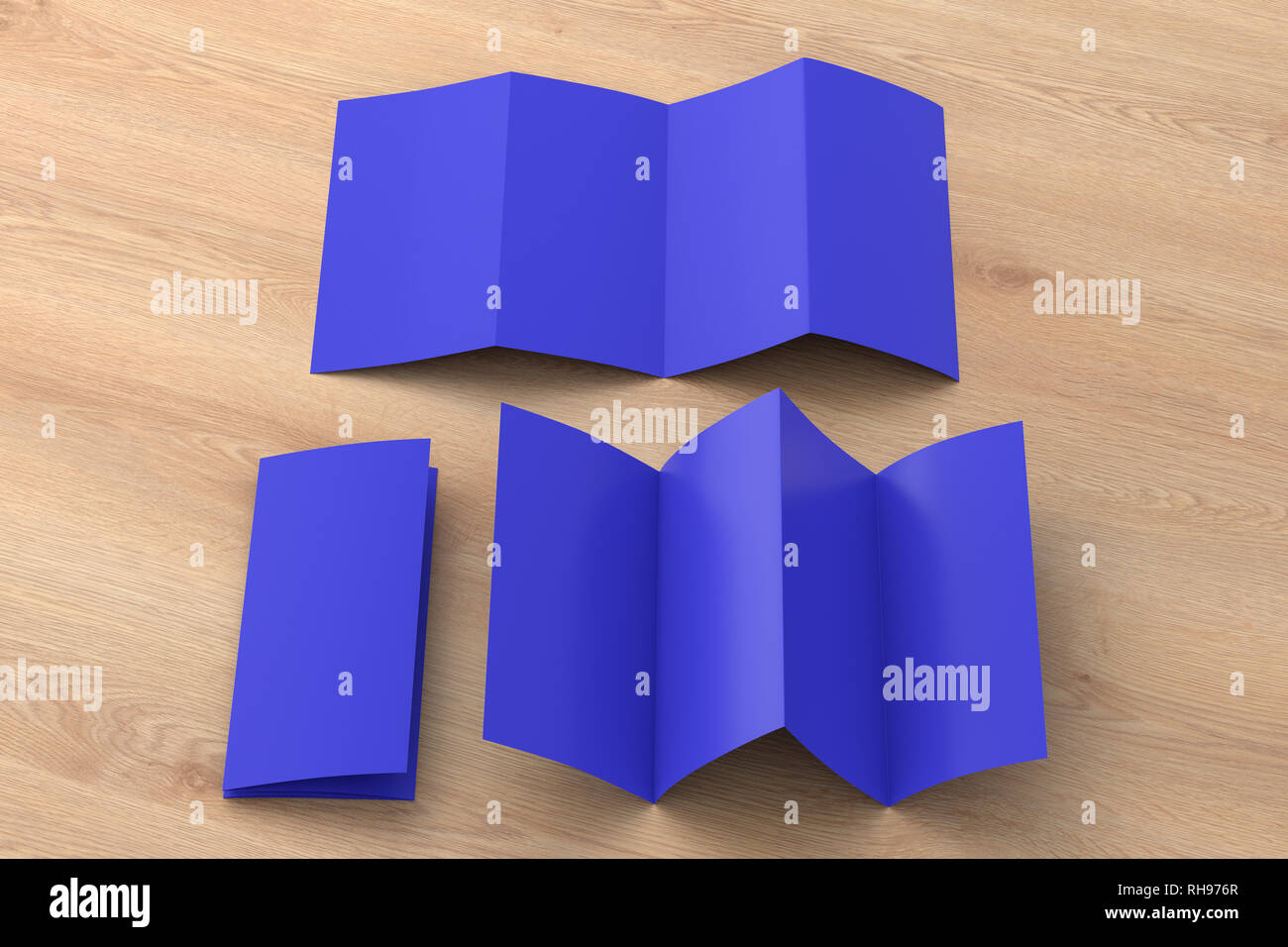 Blank blue folded paper leaflet on wooden background. Eight pages, four ...