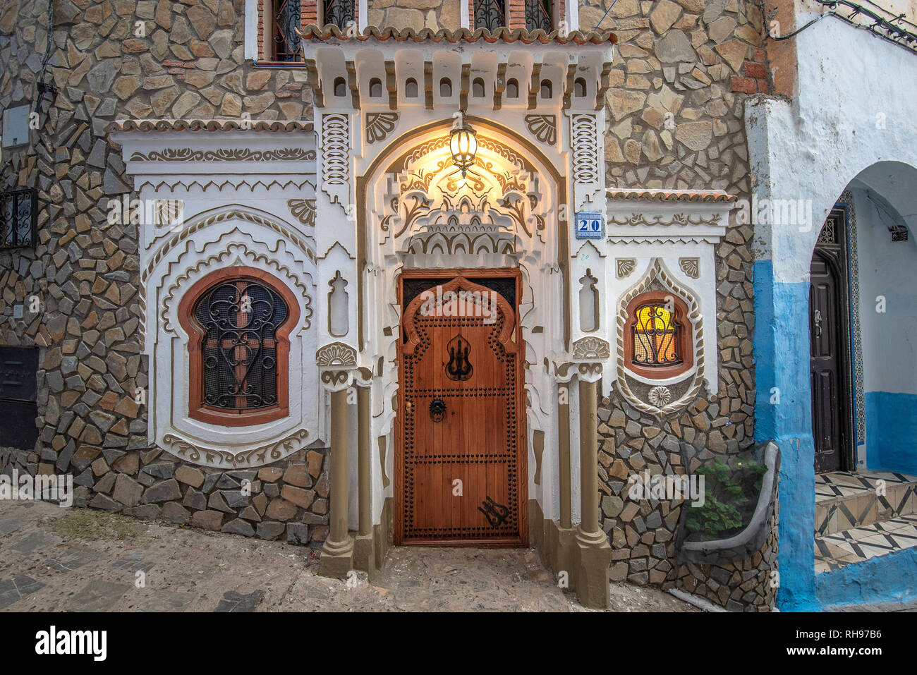 Typical, old, brown intricately carved, Moroccan riad window and door ...