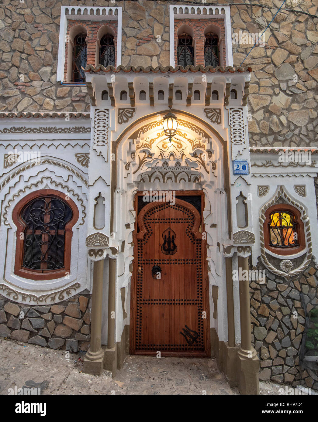 Typical, old, brown intricately carved, Moroccan riad window and door ...