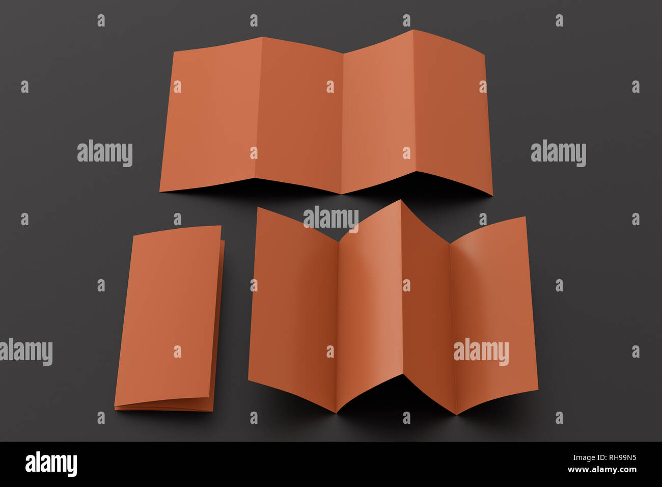 Blank brown folded paper leaflet on black background. Eight pages, four ...