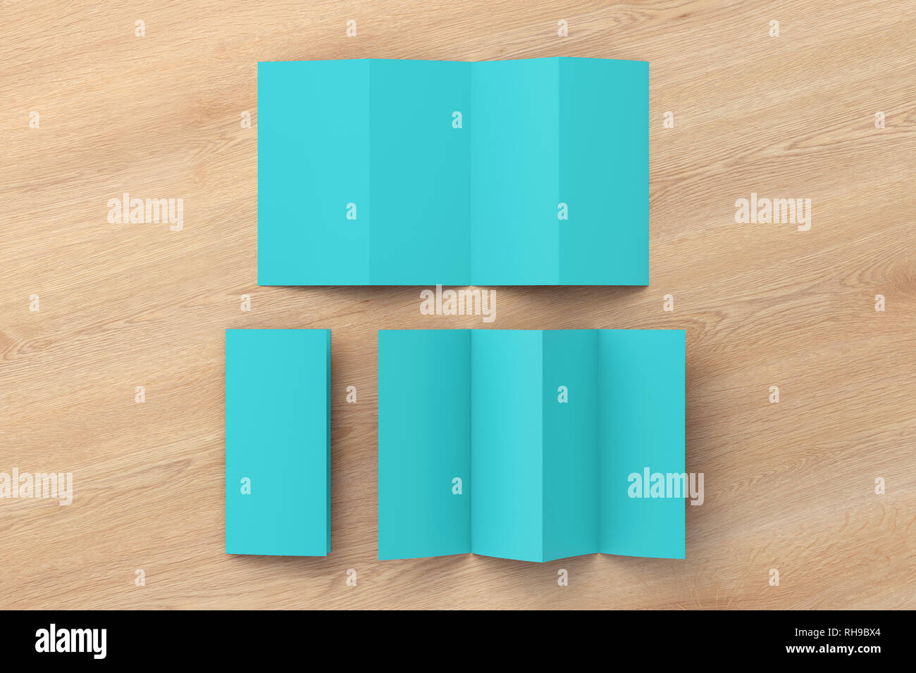 Blank cyan folded paper leaflet on wooden background. Eight pages, four ...