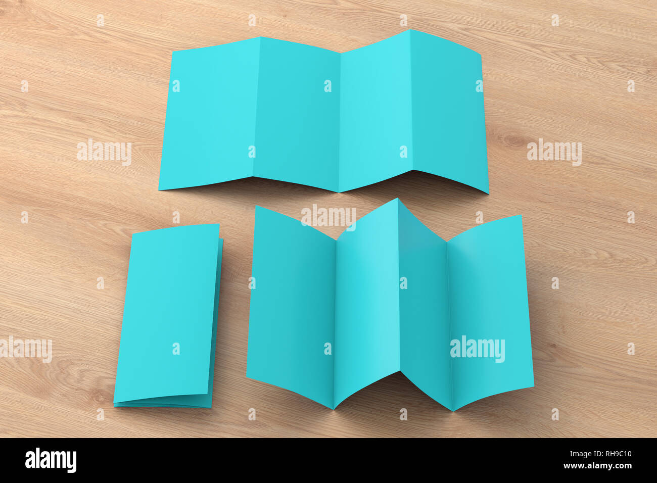 Blank cyan folded paper leaflet on wooden background. Eight pages, four ...