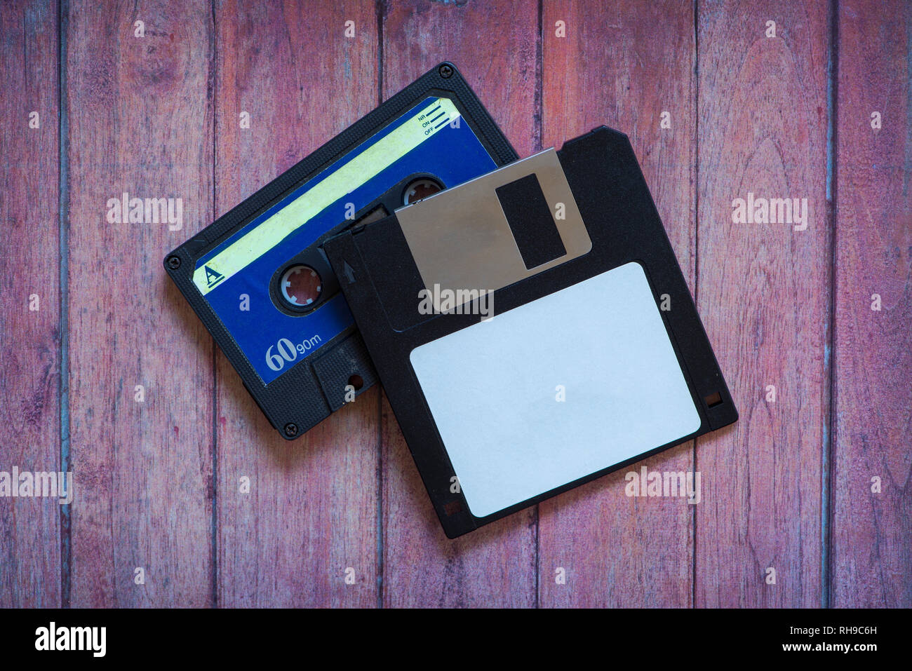 Antique pc diskettes and cassettes on a brown wooden background Stock ...