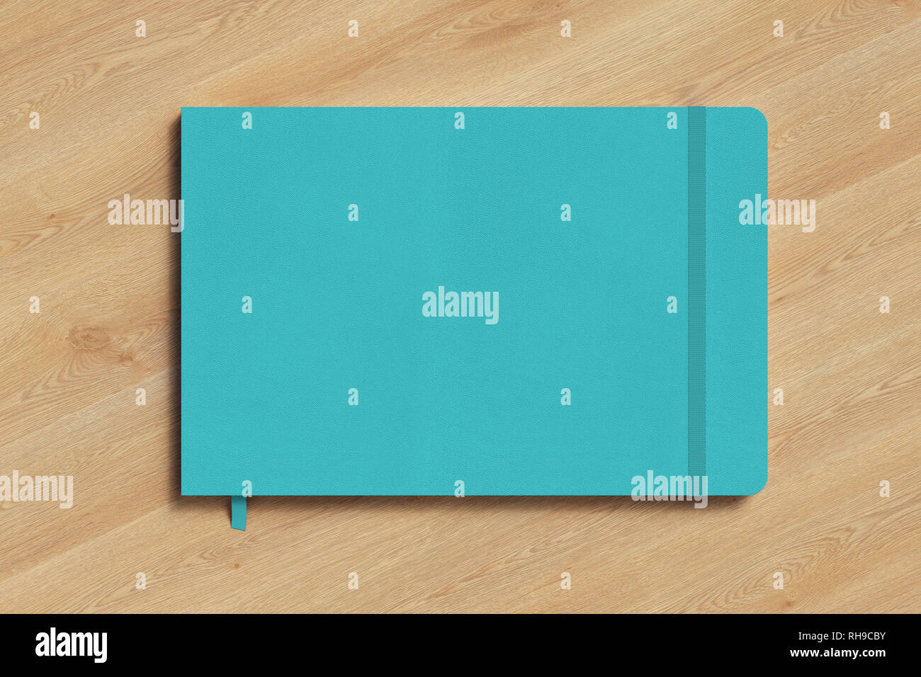Cyan horizontal notebook with elastic band on wooden background Stock ...
