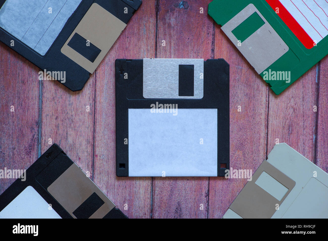 Antique pc diskettes on a brown wooden background Stock Photo - Alamy