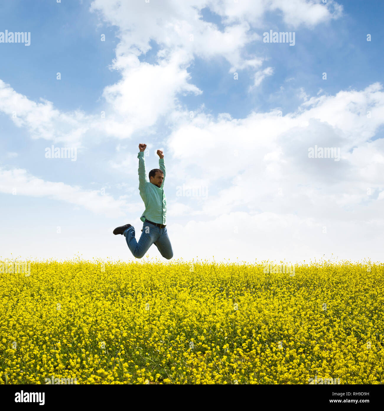 Jumping Happy Young Man Stock Photo - Alamy