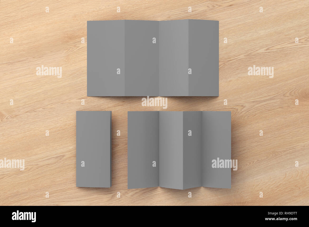 Blank gray folded paper leaflet on wooden background. Eight pages, four ...