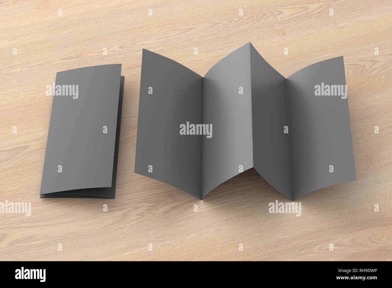 Blank gray folded paper leaflet on wooden background. Eight pages, four ...