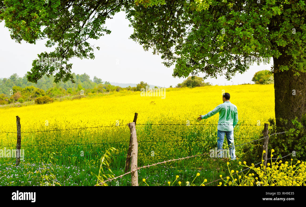 Man Standing in Field Stock Photo - Alamy